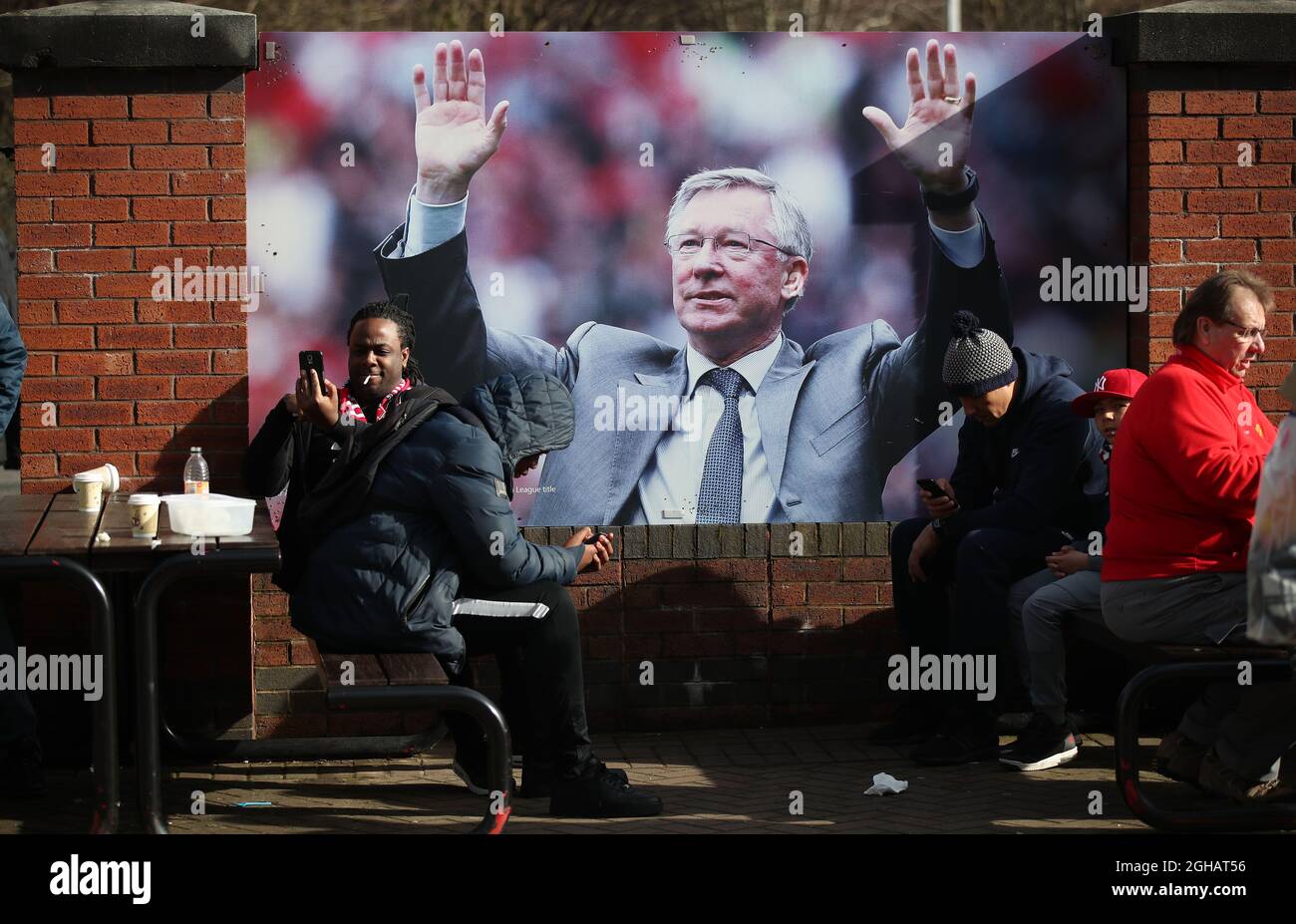 Fans outside the ground before the English Premier League match at Old ...