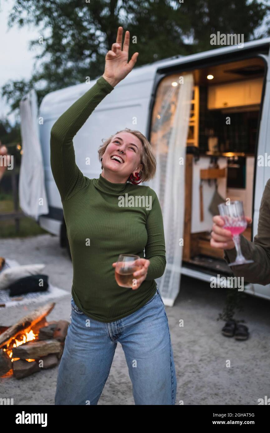 Young woman dancing in party during vacation Stock Photo - Alamy