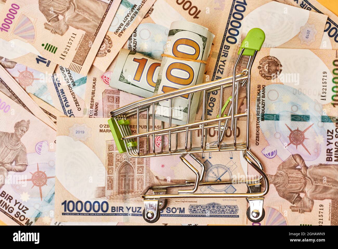 Buying us dollars in Uzbekistan. US dollars roll in shopping trolley ...