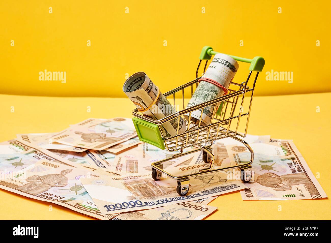 Buying us dollars in Uzbekistan. US dollars roll in shopping trolley ...