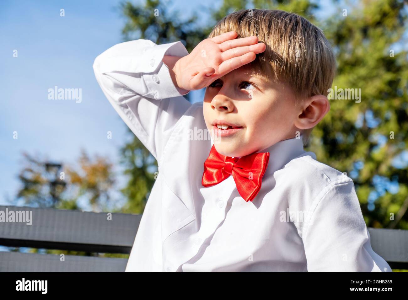 Small Boy looking on a Sun in the Summer Park Stock Photo - Alamy