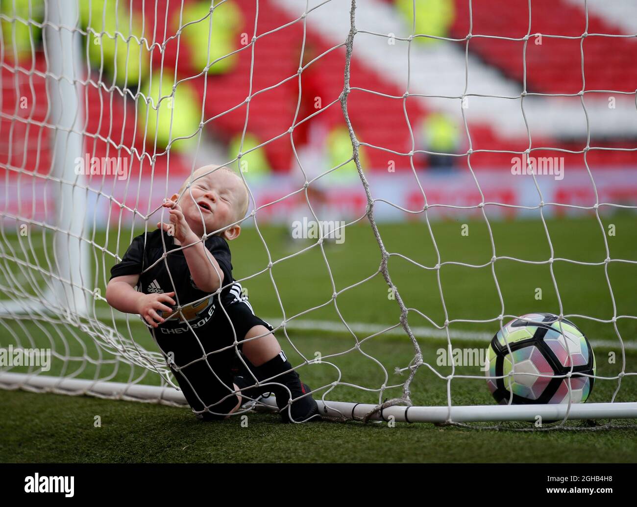 Kit Rooney son of Wayne takes a tumble in the back of the net during ...