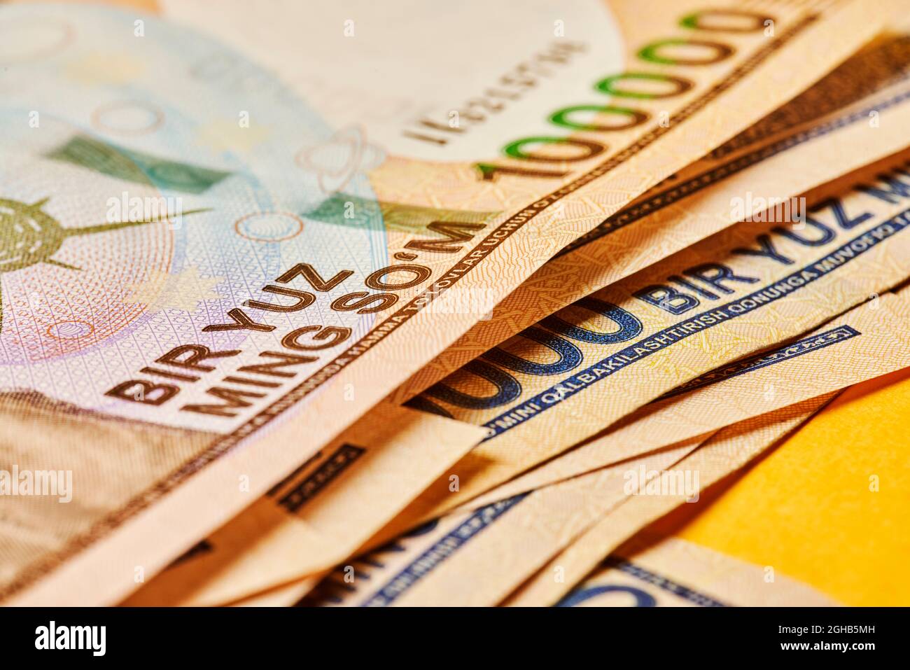 Macro shot of uzbek sum banknote. Pile of Uzbek sums. Uzbek currency ...