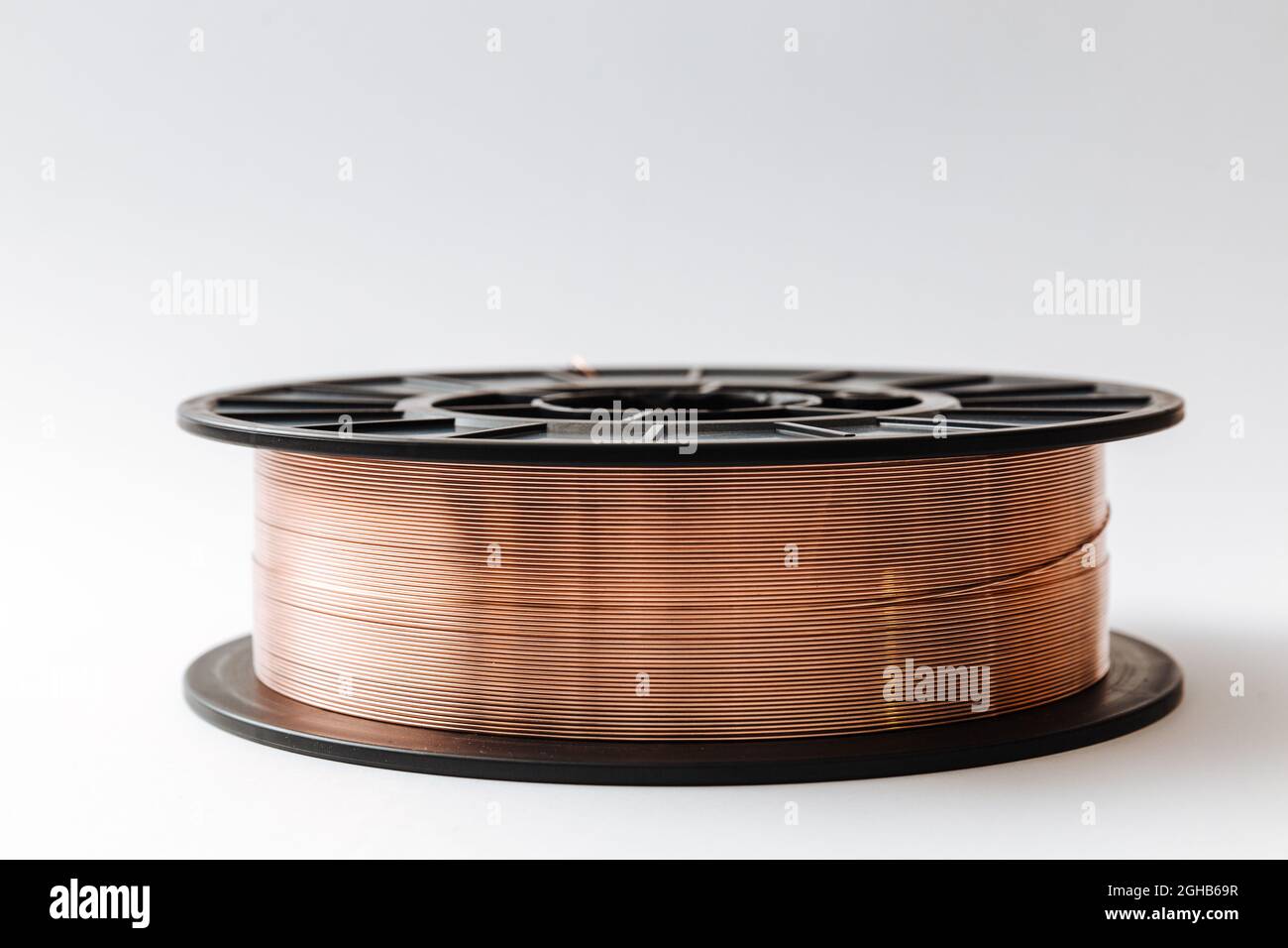 Welding wire spool on a white background Stock Photo - Alamy