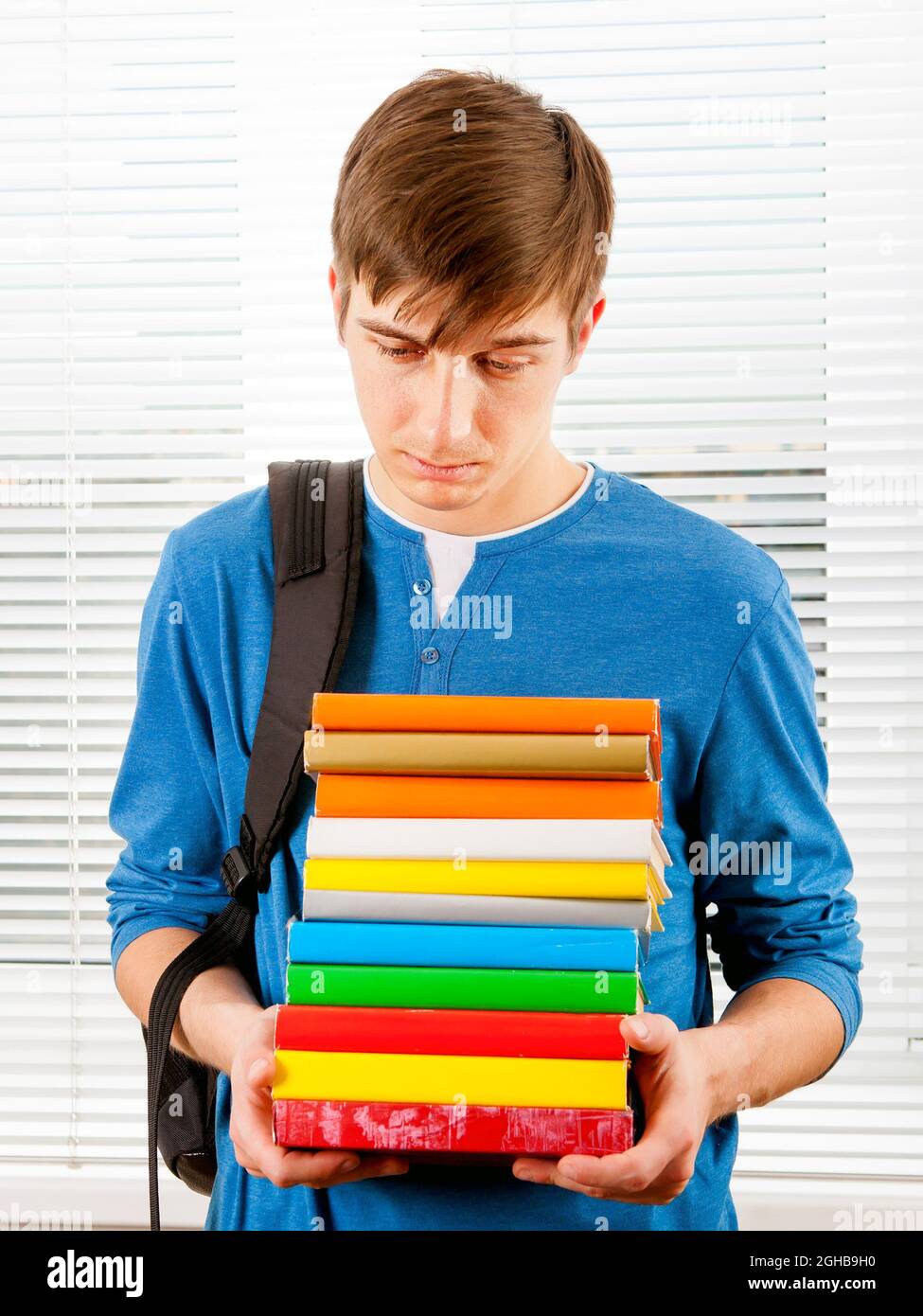 Sad Student hold a Books on the Jalousie Background Stock Photo - Alamy