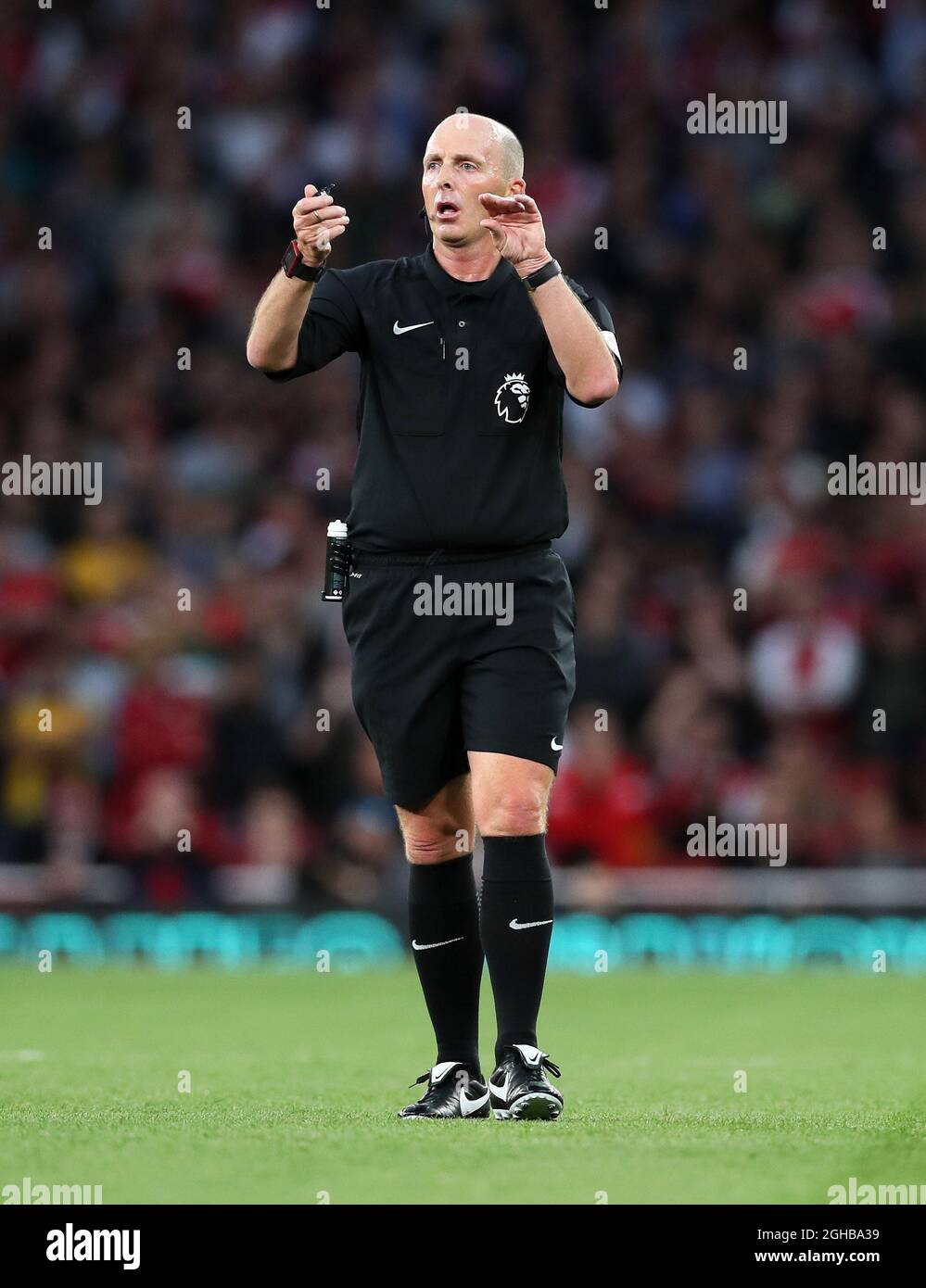 Referee Mike Dean in action during the premier league match at the ...