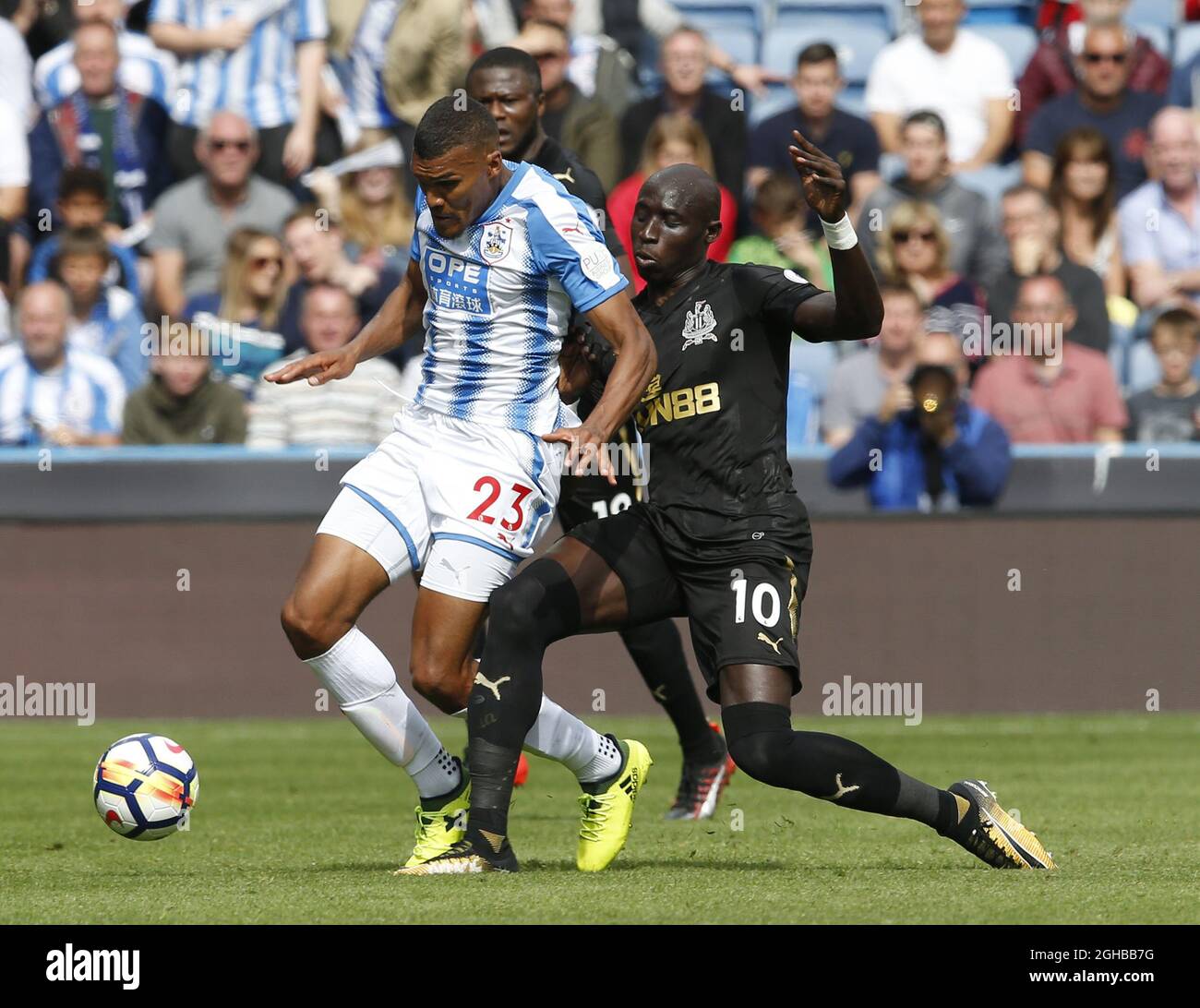 Collin Quaner of Huddersfield Town tackled by Mohamed Diame of ...