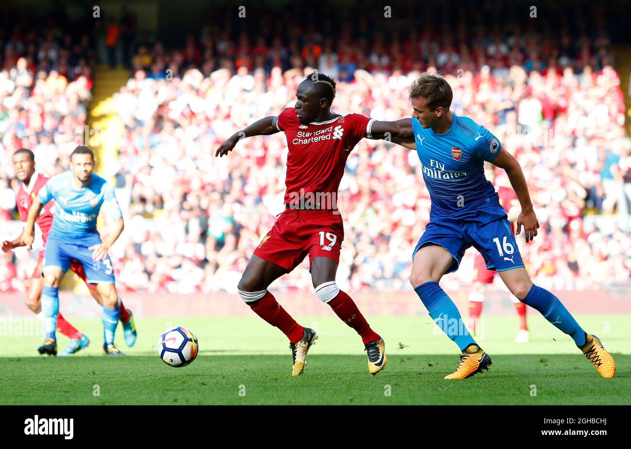 Liverpool's Sadio Mane in action with Arsenal's Rob Holding (R) during ...