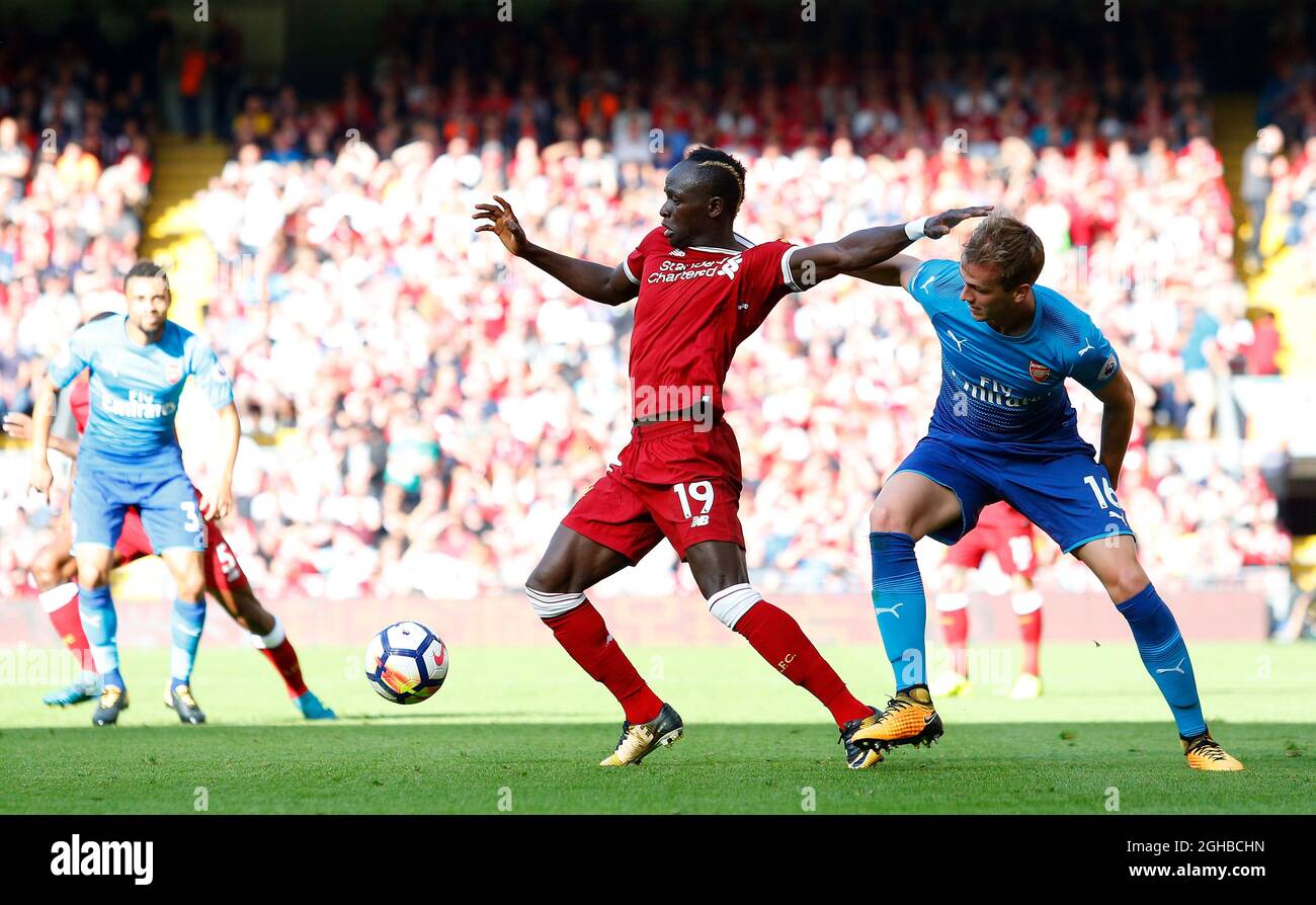 Liverpool's Sadio Mane in action with Arsenal's Rob Holding (R) during ...