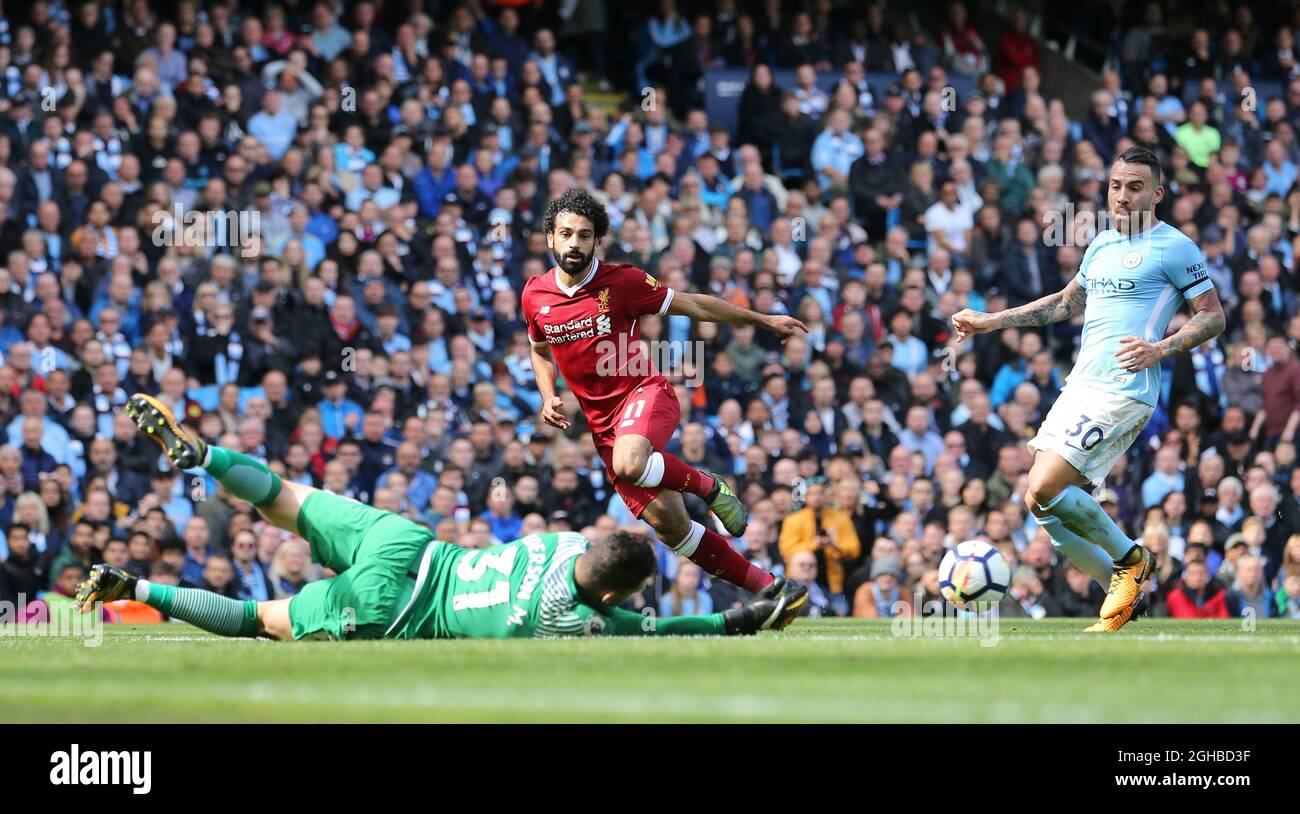 Ederson of Manchester City makes a save from Mohamed Salah of Liverpool ...