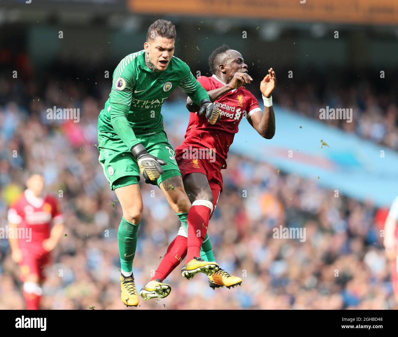 Ederson of Manchester City collides with Sadio Mane of Liverpool ...