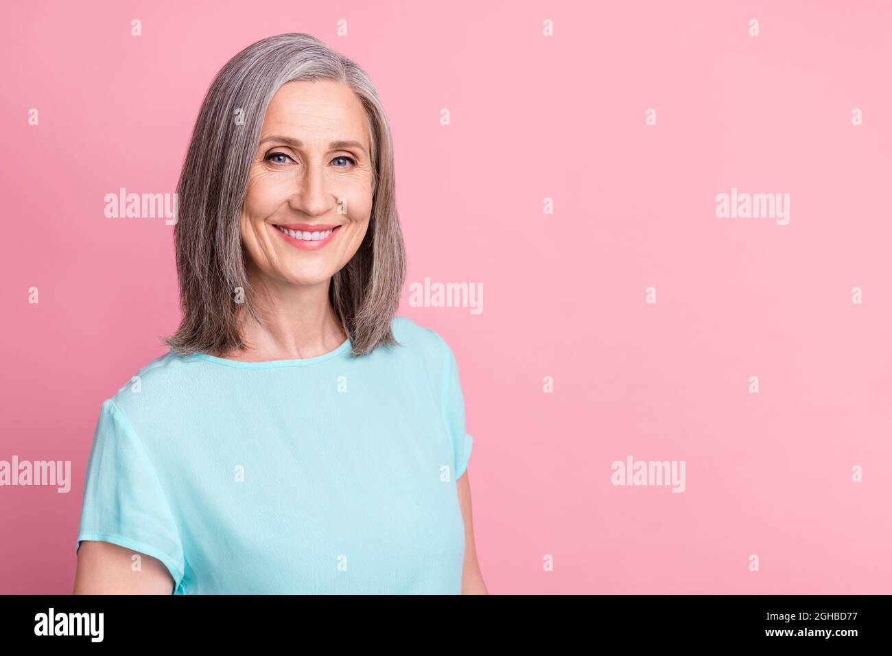 Photo of funky elder grey hairdo lady wear blue blouse isolated on pink ...
