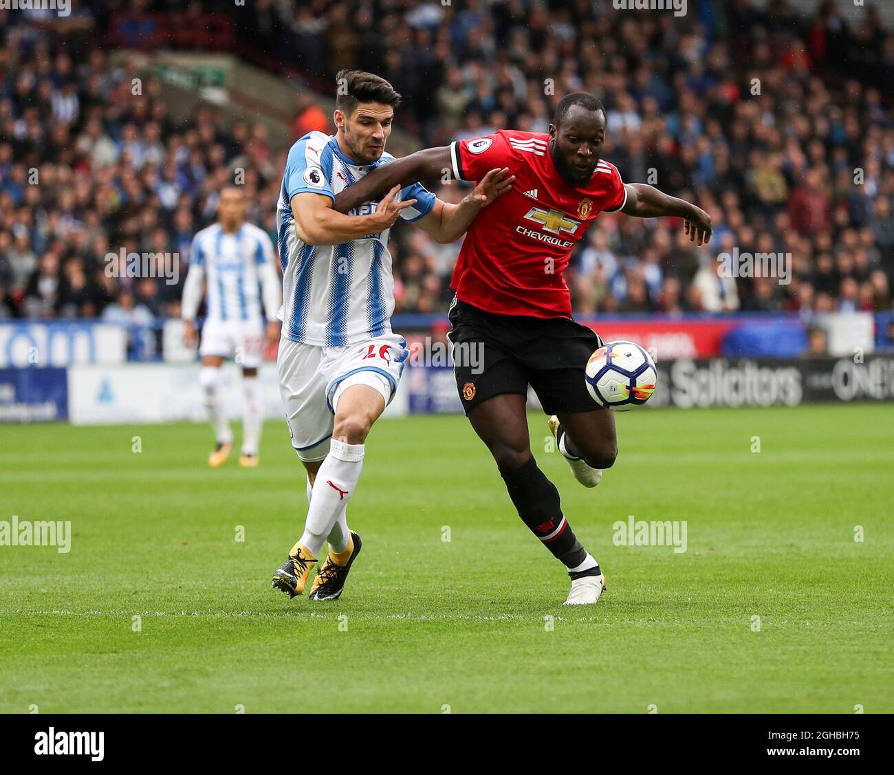 Romelu Lukaku of Manchester United in action with Christopher Schindler ...