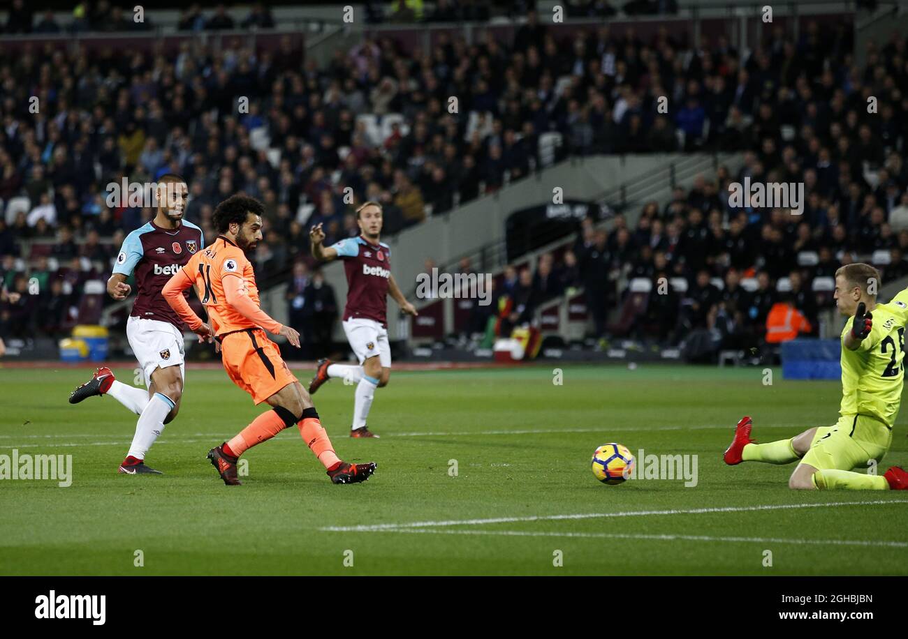 Liverpool's Mohamed Salah scoring his sides opening goal during the ...