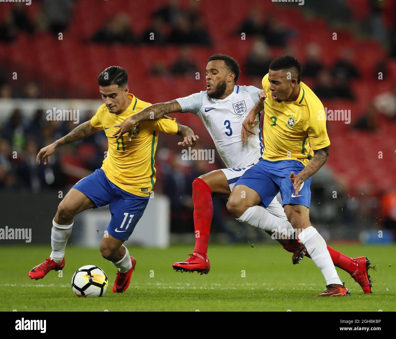 England's Ryan Bertrand tussles with Brazil's Philippe Coutinho and ...