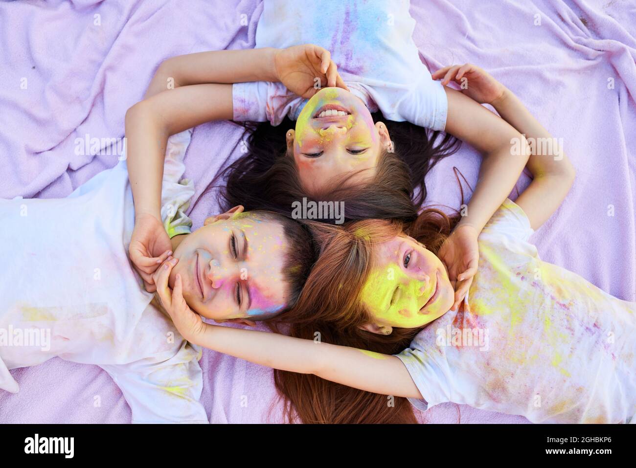 children with colored powder having fun outdoor Stock Photo - Alamy