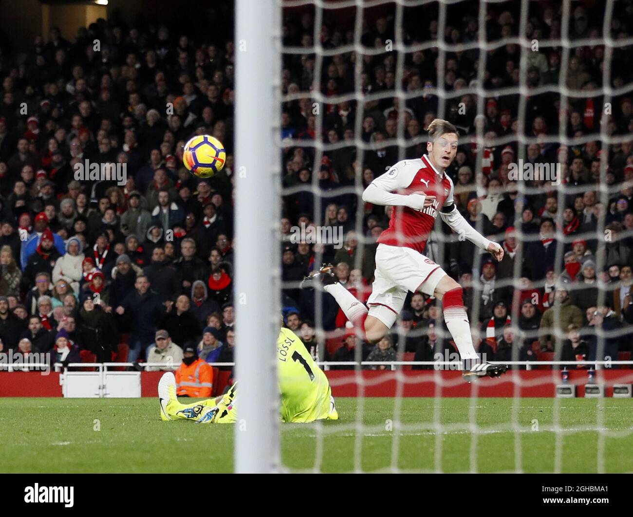 Arsenal's Mesut Ozil scoring his sides fourth goal during the premier ...