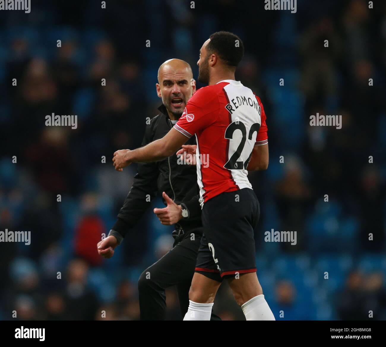 Josep Guardiola manager of Manchester City has a lively discussion with ...
