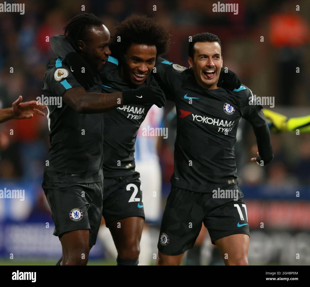 Pedro of Chelsea (r) celebrates scoring the third goal with Victor ...