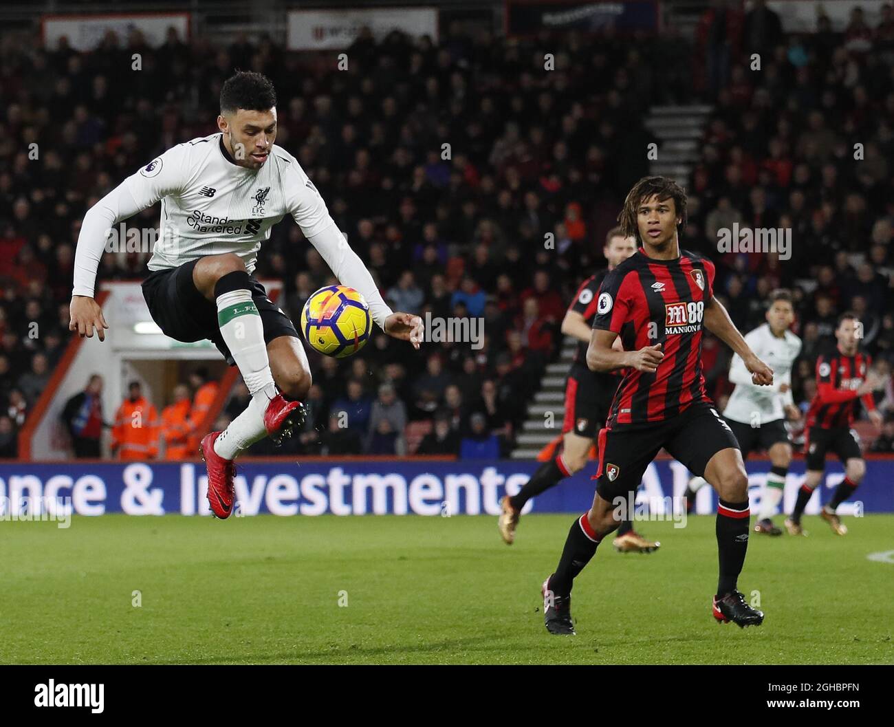 Alex Oxlade-Chamberlain of Liverpool jumps up to control the ball ...