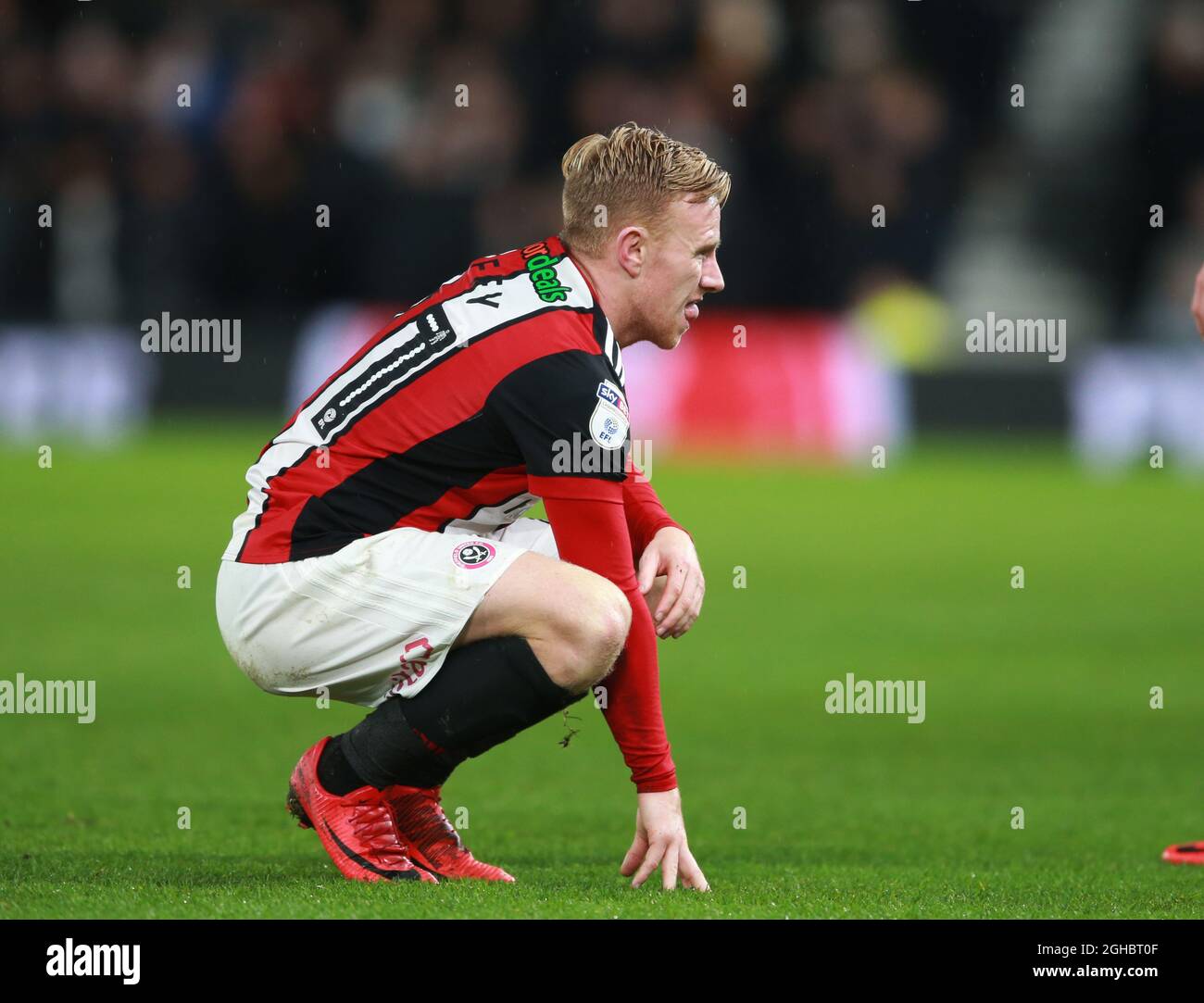 Mark Duffy of Sheffield Utd goes down injured during the Championship ...