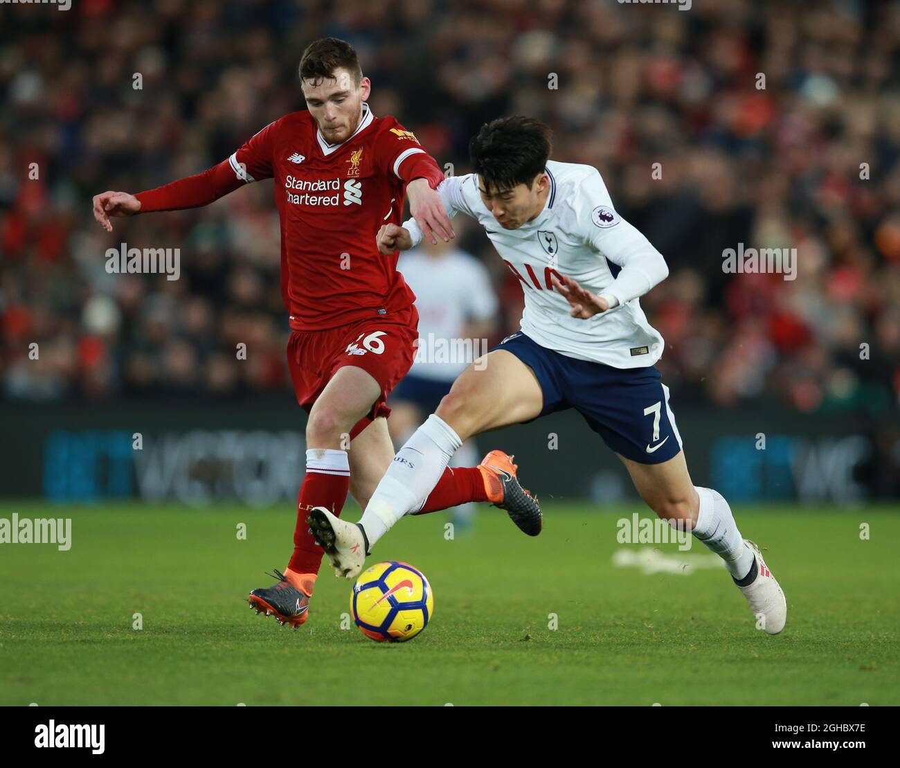 Andrew Robertson of Liverpool tackles Son Heung-Min of Tottenham during ...