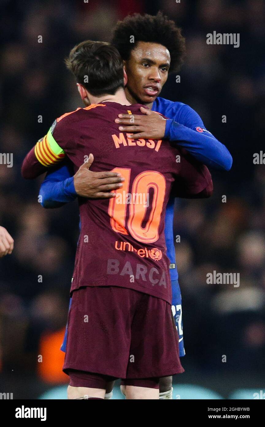 Willian of Chelsea and Barcelona's Lionel Messi hug after the champions ...