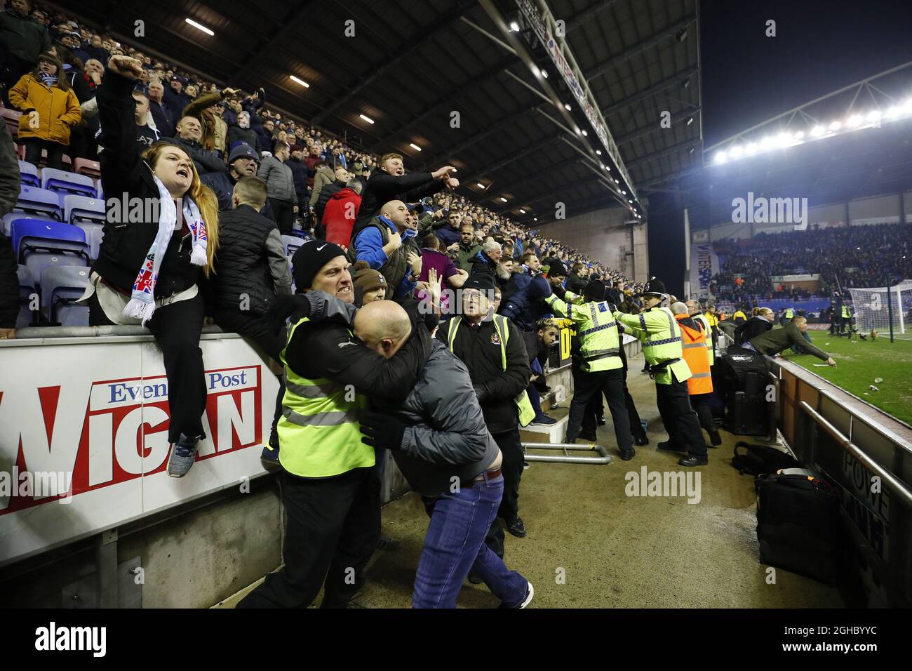 Stewards and fans clash Stock Photo - Alamy