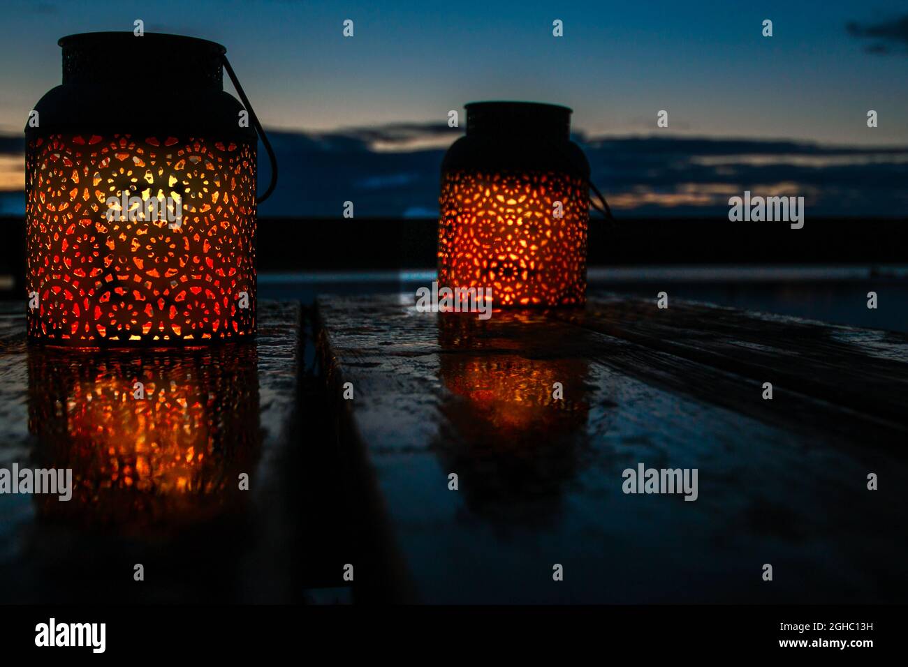 Romantic evening with candlelight and sunset Stock Photo - Alamy
