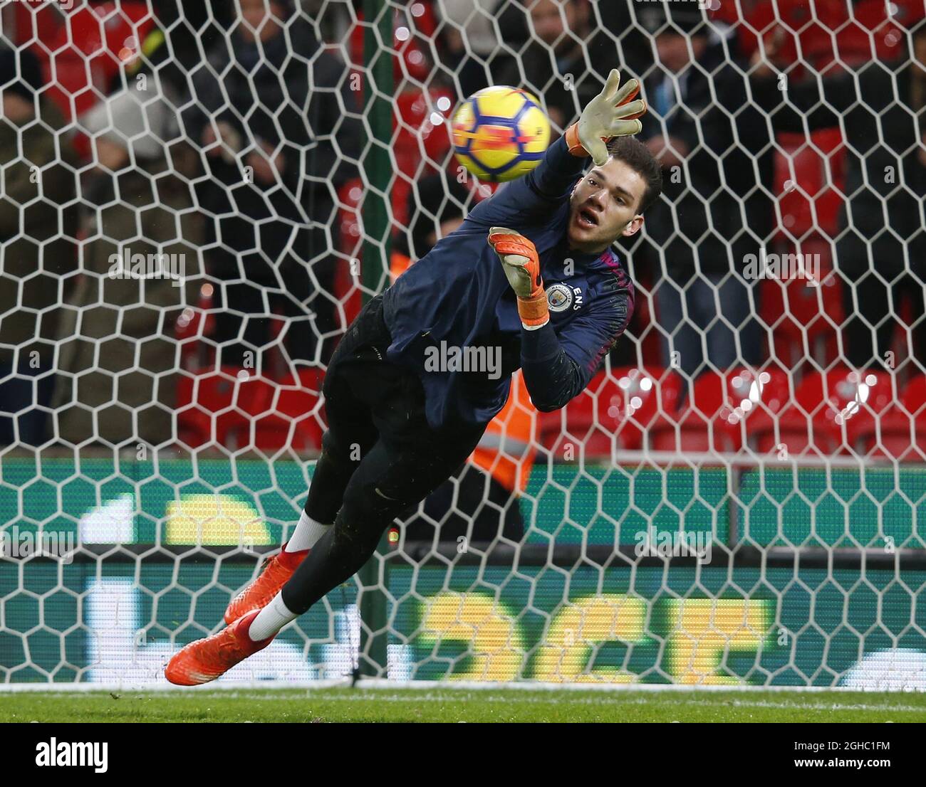 Ederson of Manchester City makes a save during warm up before the ...