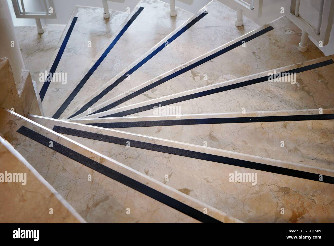 Top view on spiral staircase. Steps of winding staircase made of marble ...