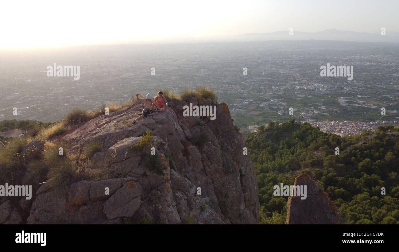 Climbing couple in the mountain. Drone view of climber woman and man ...