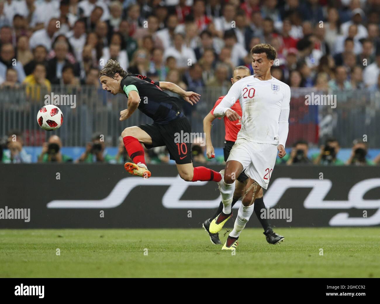 Luka Modric of Croatia tackled by Dele Alli of England during the FIFA ...