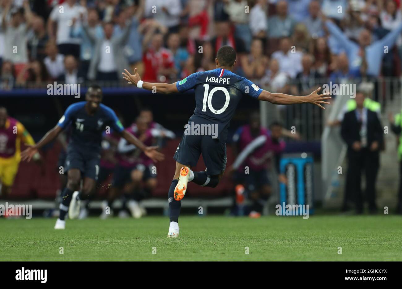 Kylan Mbappe of France turns to celebrate scoring the fourth goal ...