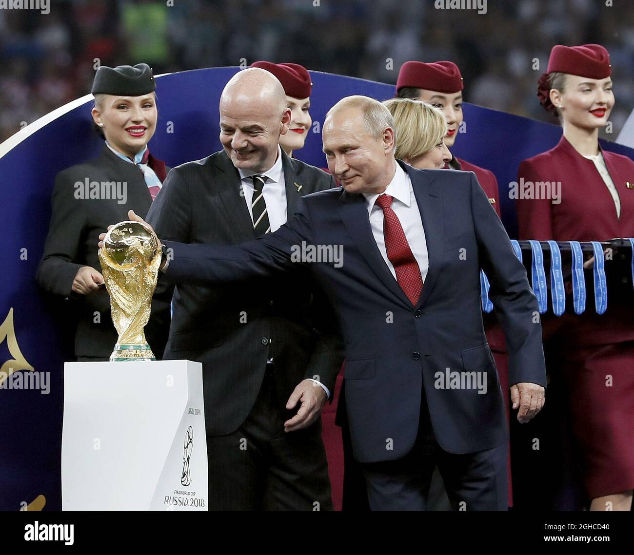 Vladimir Putin strokes the World Cup trophy during the FIFA World Cup ...