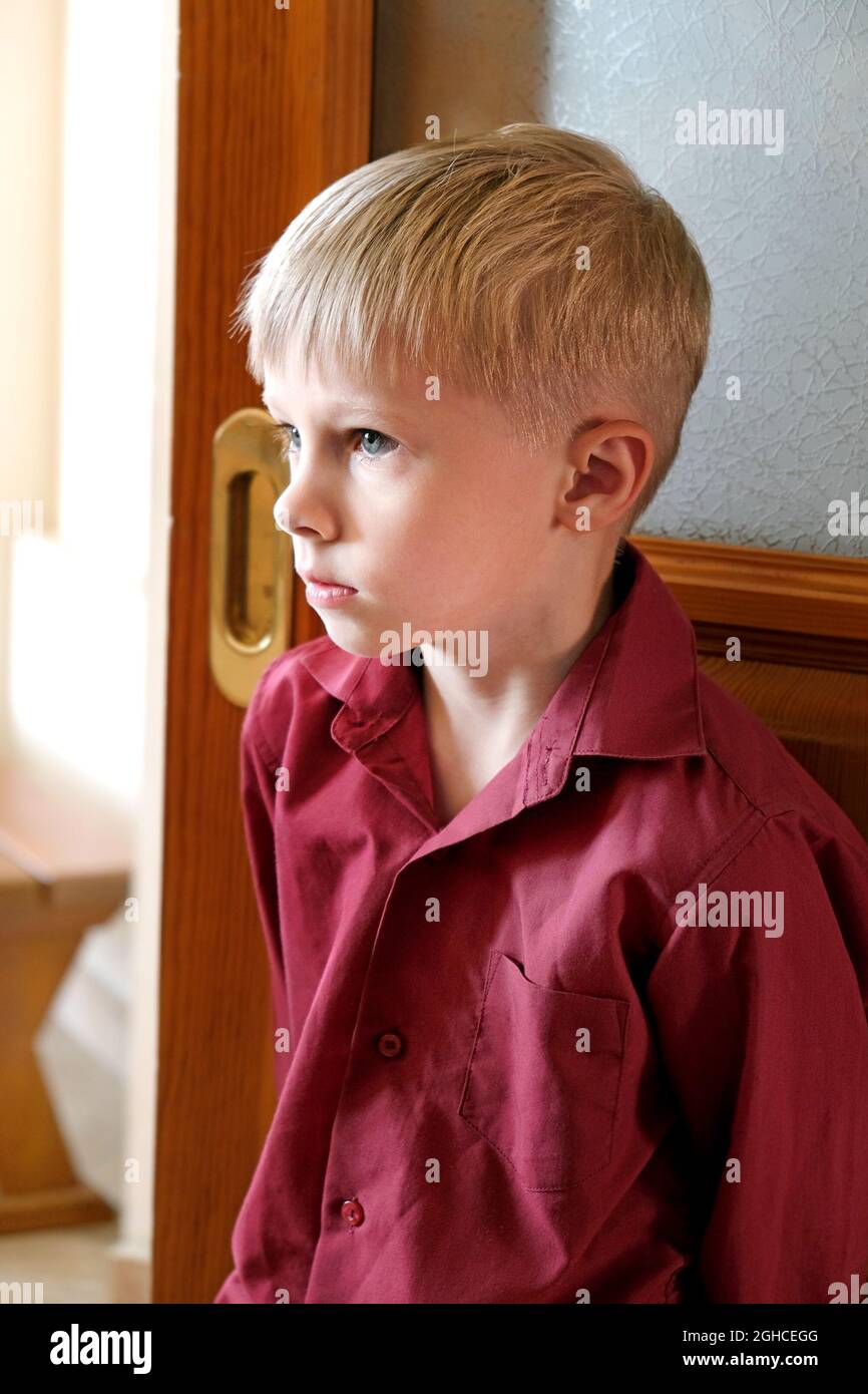 Portrait of Sad Small Boy stand in the Room Stock Photo - Alamy