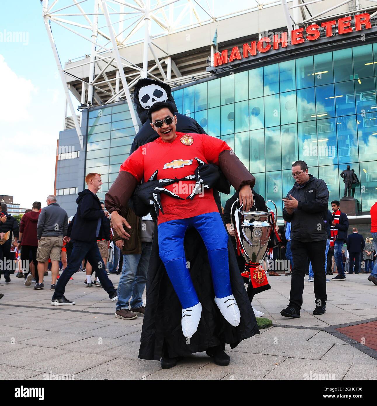 A Manchester United fan wears fancy dress during the Premier League ...