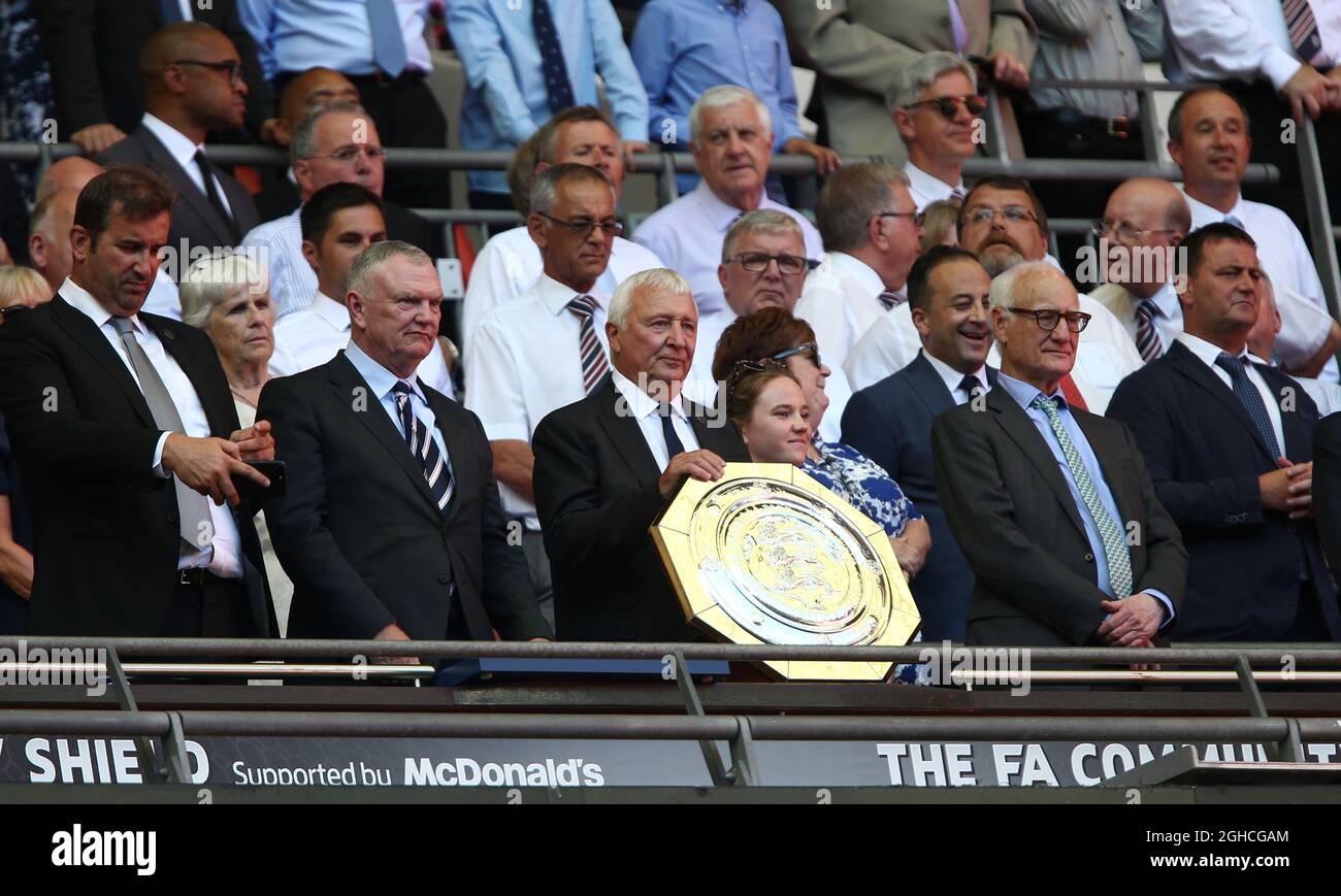 Manchester City's Mike Summerbee waits to present the trophy during the ...
