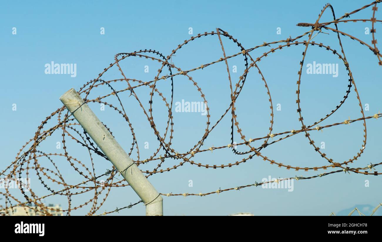 Barbed wire around fence gate hi-res stock photography and images - Alamy