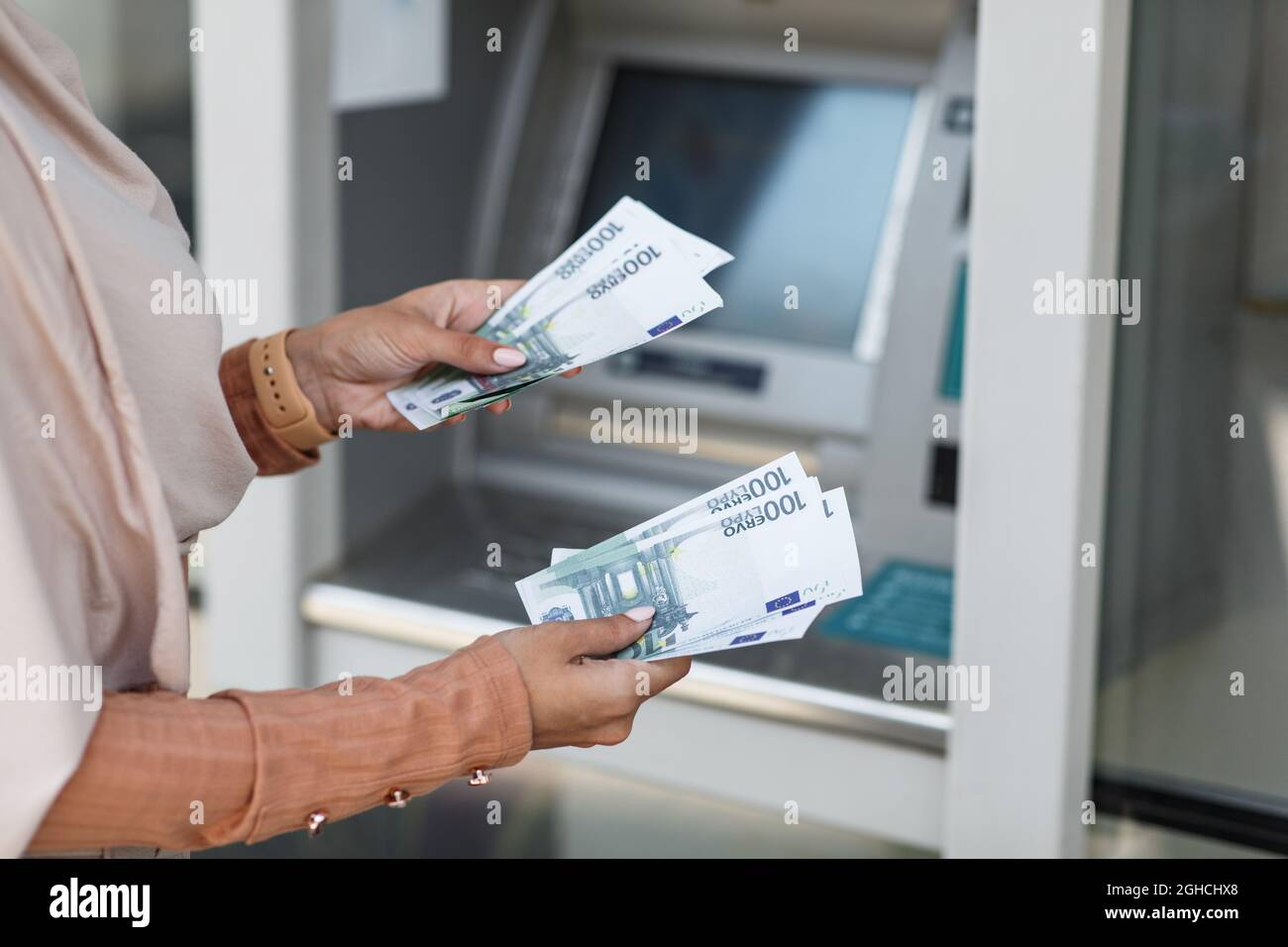 Woman hands taking money from bank cash ATM machine, close up. Cash point Stock Photo - Alamy