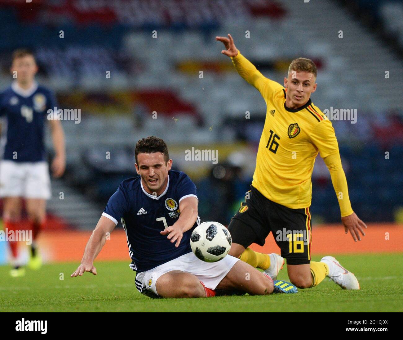 Thorgan Hazard of Belgium fouls John McGinn of Scotland during the ...