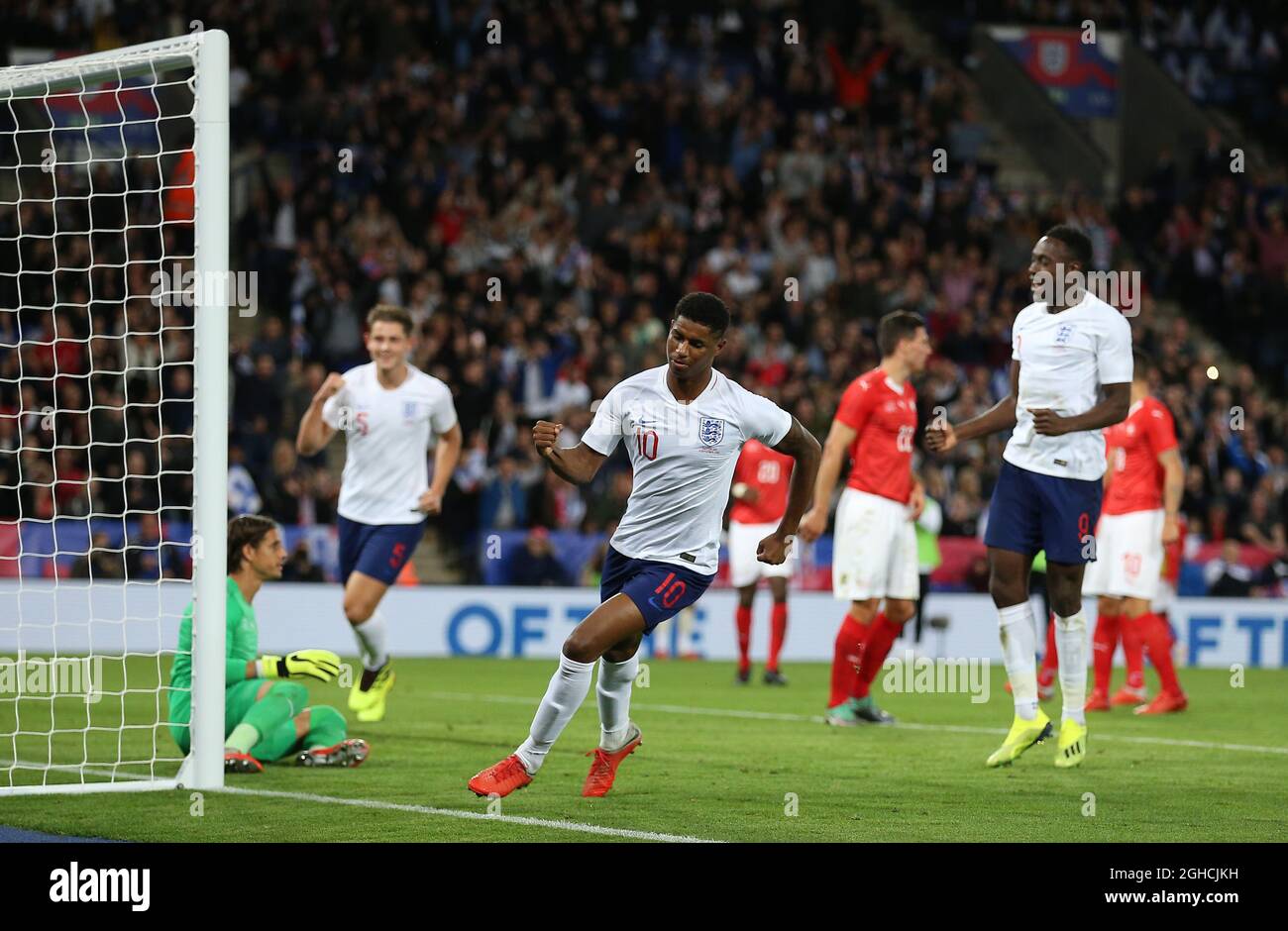Marcus Rashford of England celebrates scoring the first goal during the ...