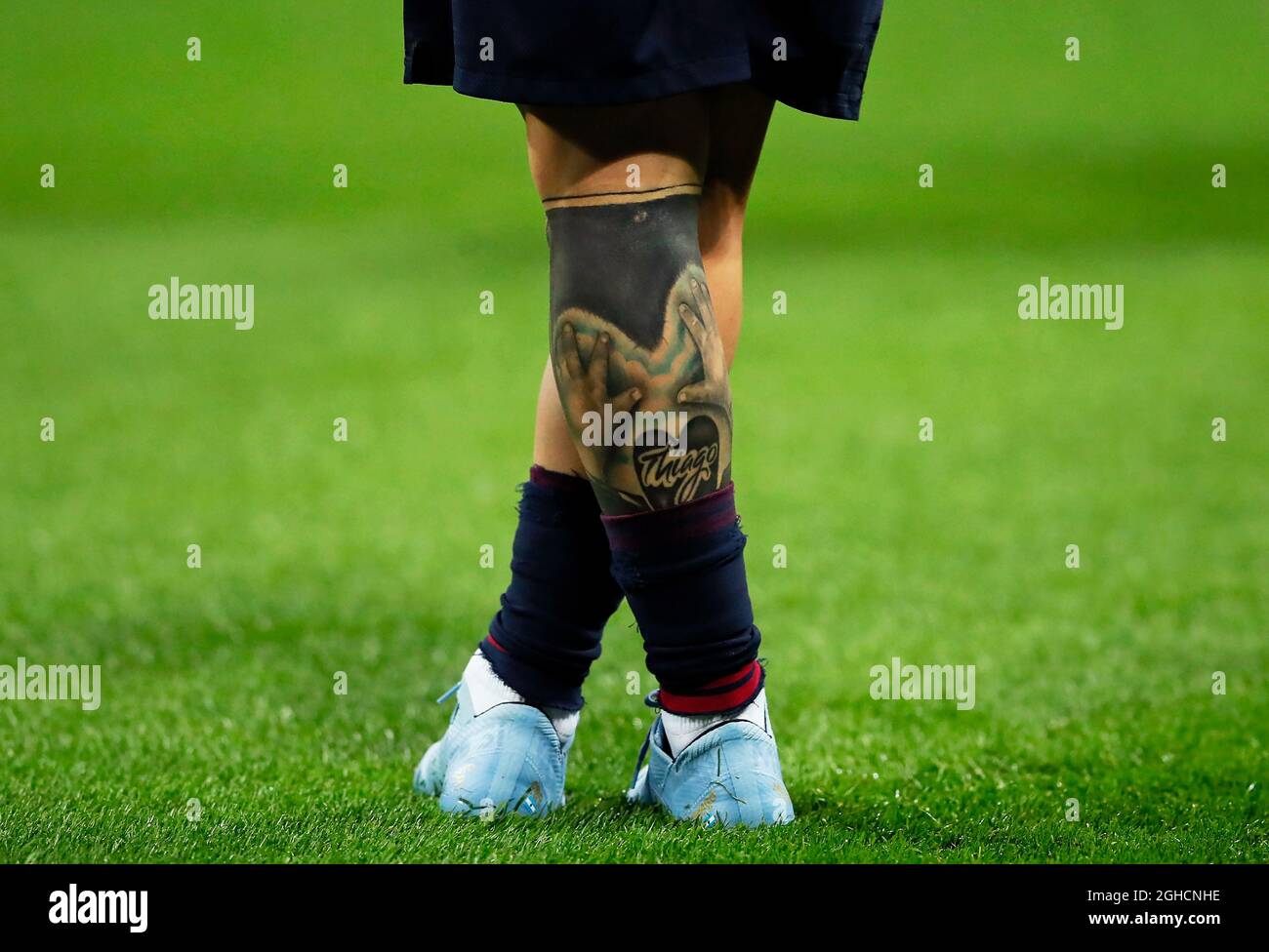 The tattooed leg of Barcelona's Lionel Messi during the UEFA Champions ...