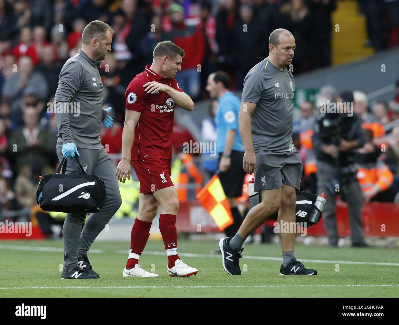 James Milner of Liverpool leaves the pitch with a suspected hamstring ...