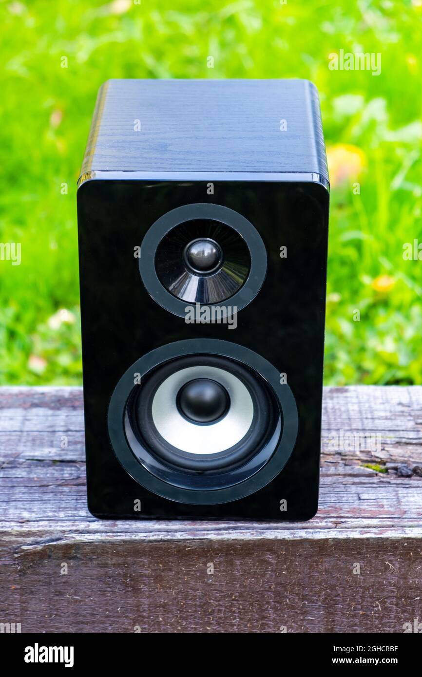 Loud speaker Box on the Bench and Grass Background Stock Photo - Alamy