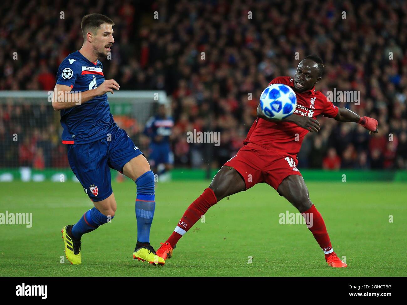 Milos Degenek of Red Star Belgrade and Liverpool's Sadio Mane during ...