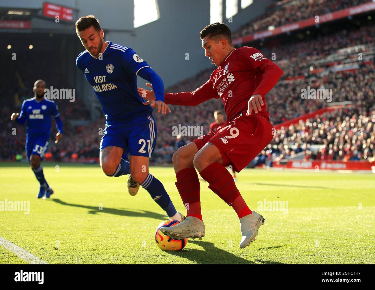 Liverpool's Roberto Firmino takes on Cardiff City's Victor Camarasa ...