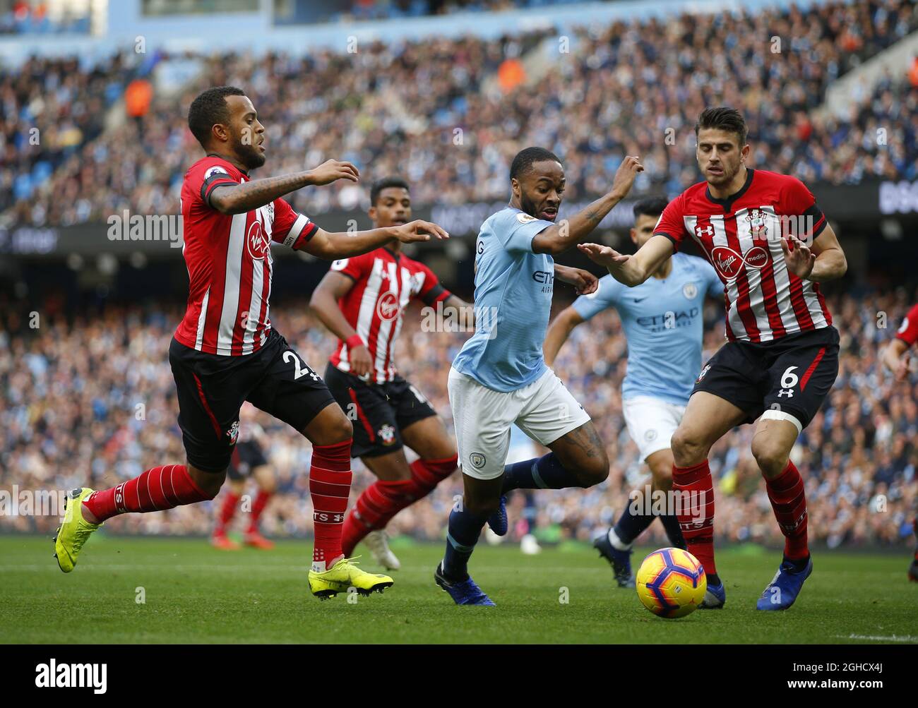 Ryan Bertrand of Southampton attempts to tackle Raheem Sterling of ...
