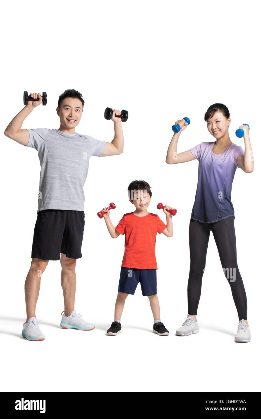 Happy young family exercising together Stock Photo - Alamy