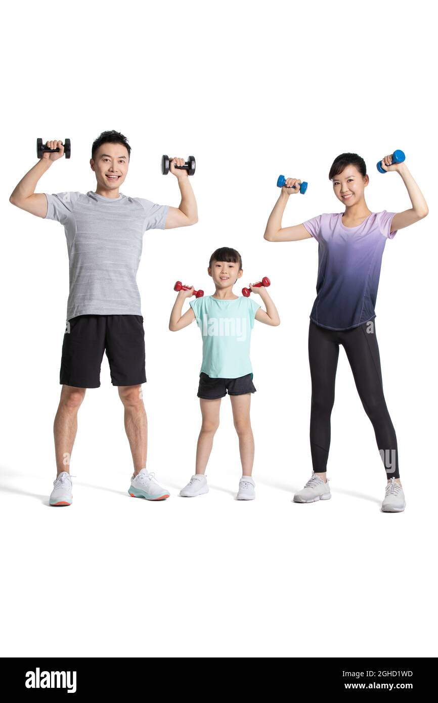 Happy young family exercising together Stock Photo - Alamy
